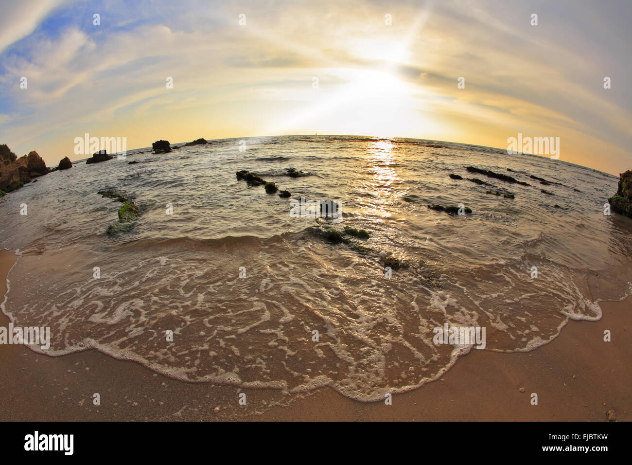 Magnificent sunset on coast of sea Stock Photo - Alamy