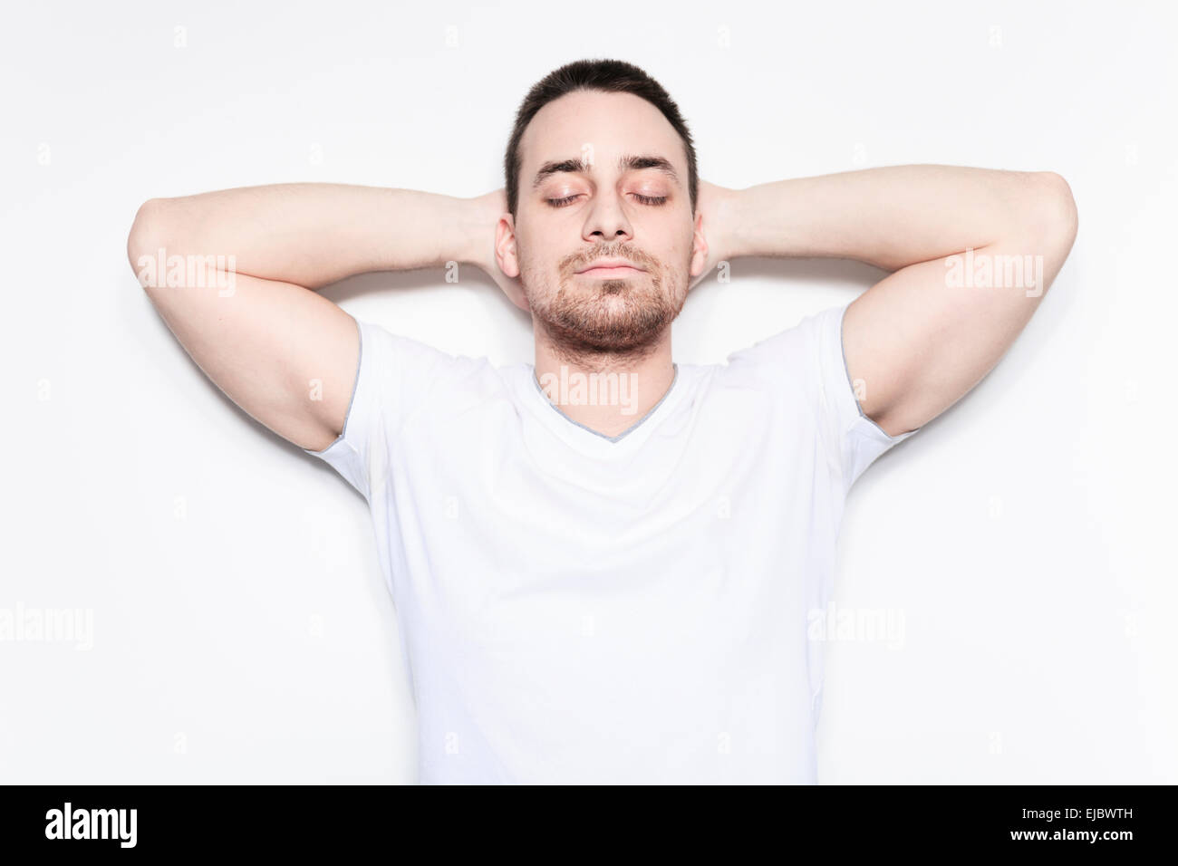 A relax man over a studio white background Stock Photo - Alamy