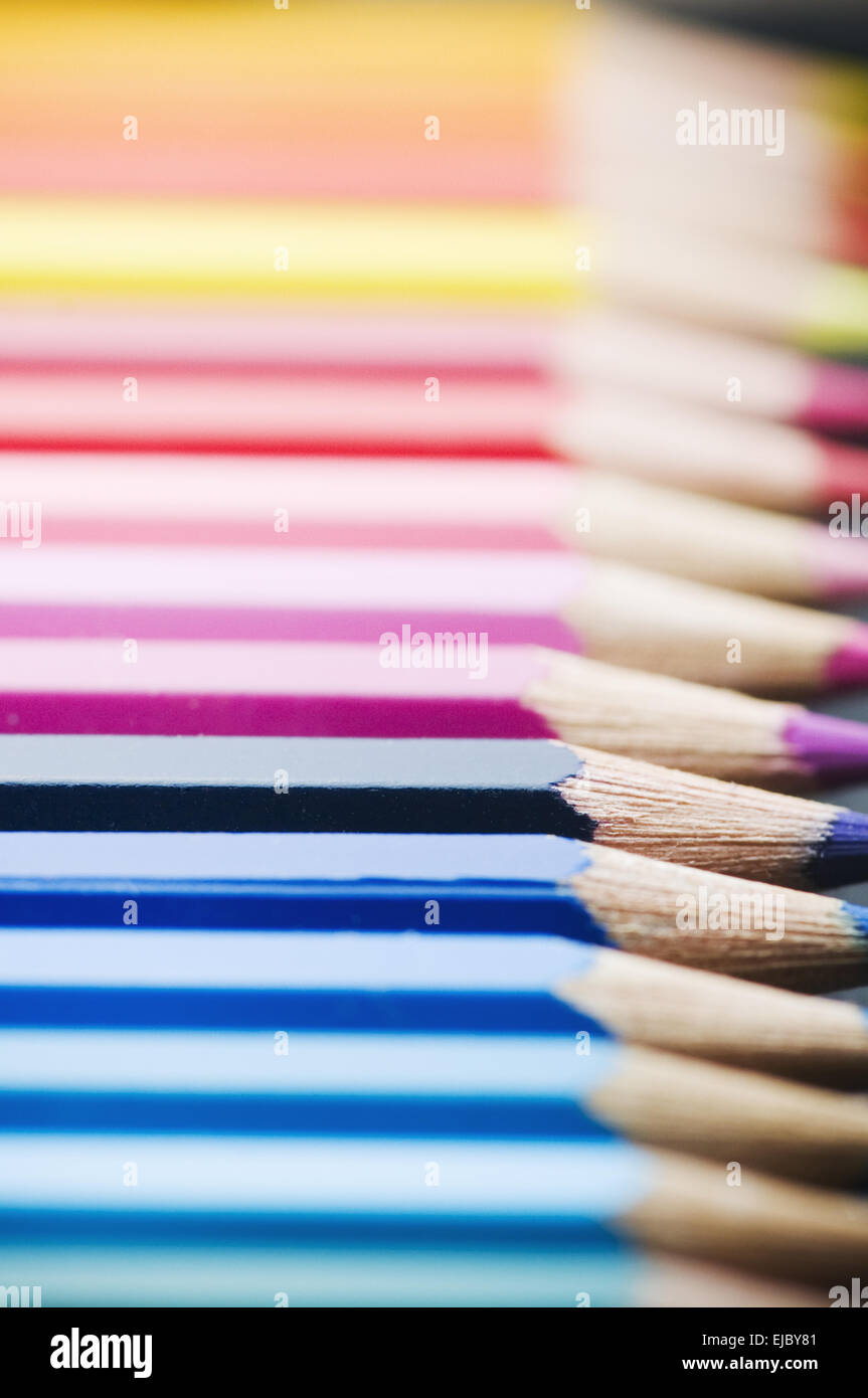 Colored pencils in a row Stock Photo - Alamy