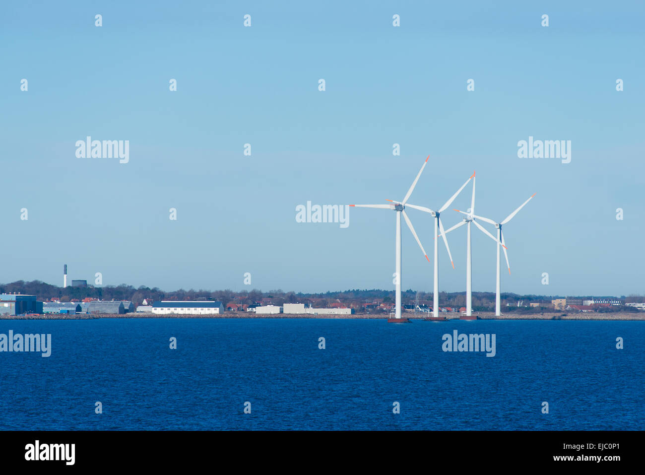 Four windmills in the sea Stock Photo - Alamy