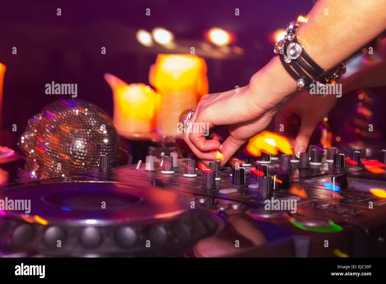 DJ hands on the remote. nightclub Stock Photo - Alamy