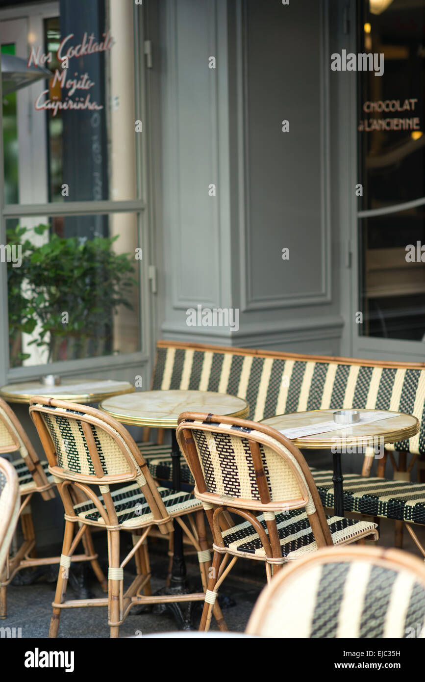 Sidewalk cafe chairs in Paris, France Stock Photo - Alamy