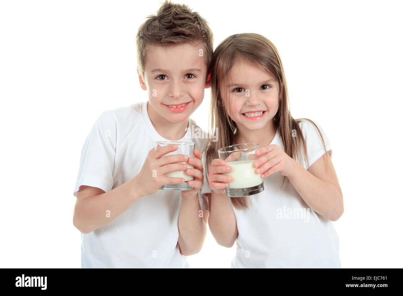 Child drinking milk on white background Stock Photo - Alamy