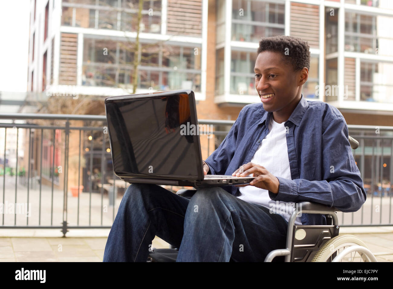 Wheelchair bound man using hi-res stock photography and images - Alamy