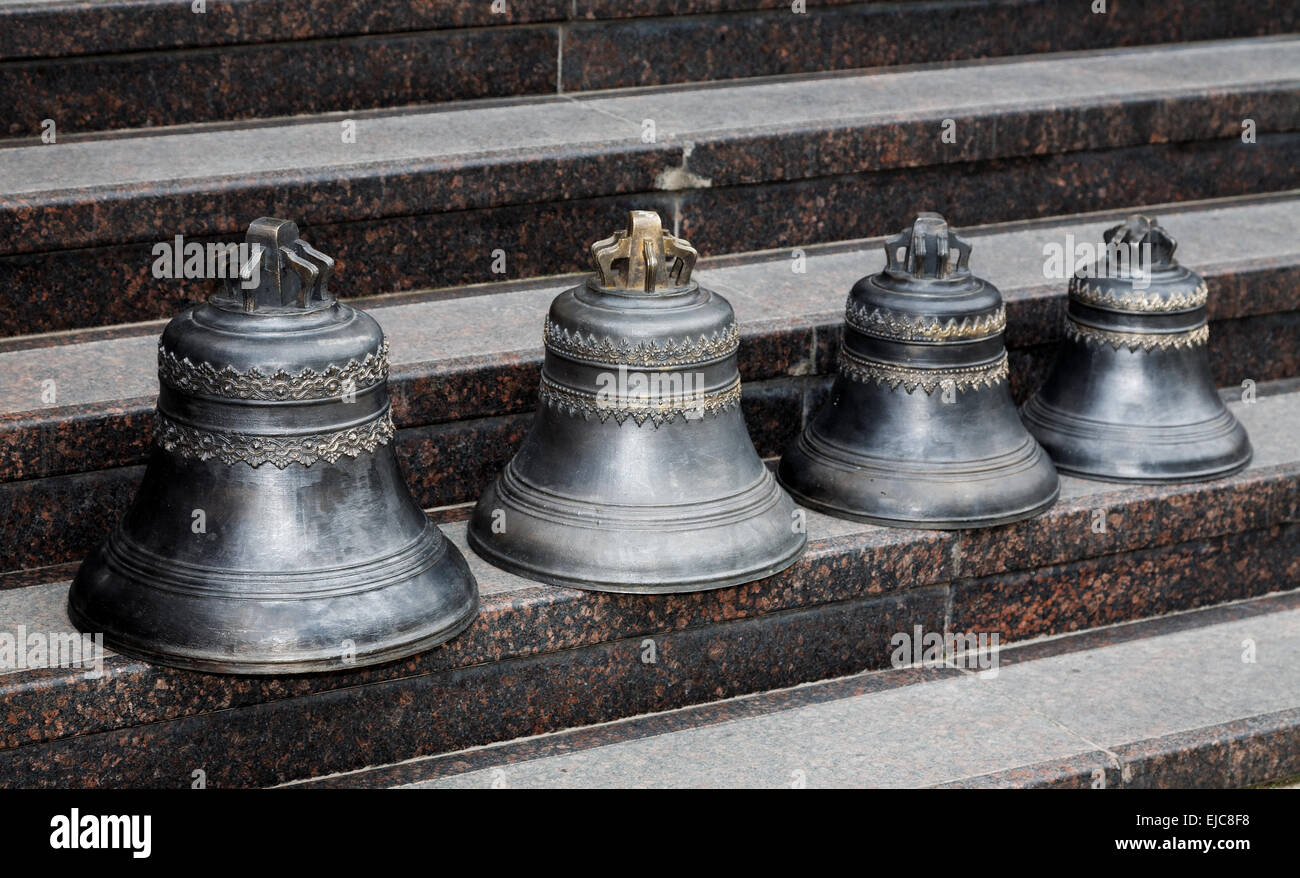 Small church bells stand in a row Stock Photo - Alamy