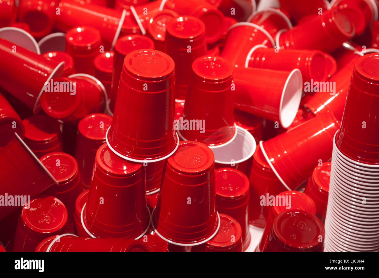 Many red Solo cups some stacked, others turned over Stock Photo - Alamy