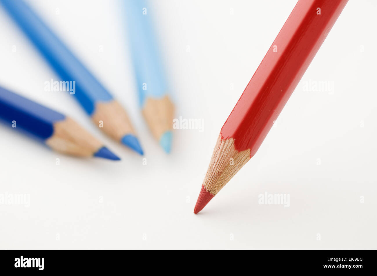 three blue and one red pencils Stock Photo - Alamy