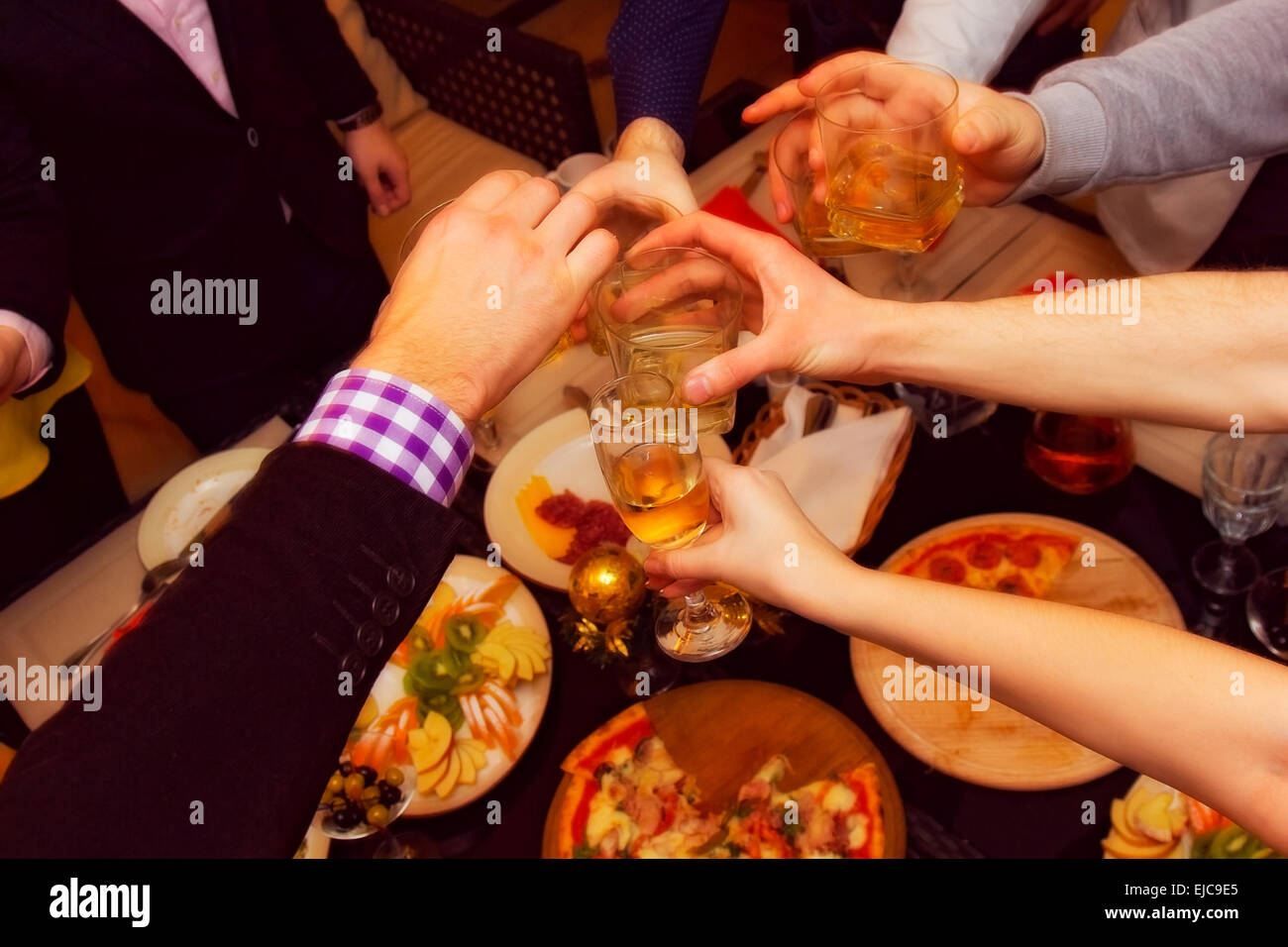 Group of people toasting at a celebration Stock Photo - Alamy