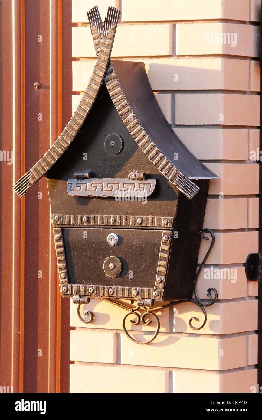 forged mailbox handmade on a white background Stock Photo - Alamy