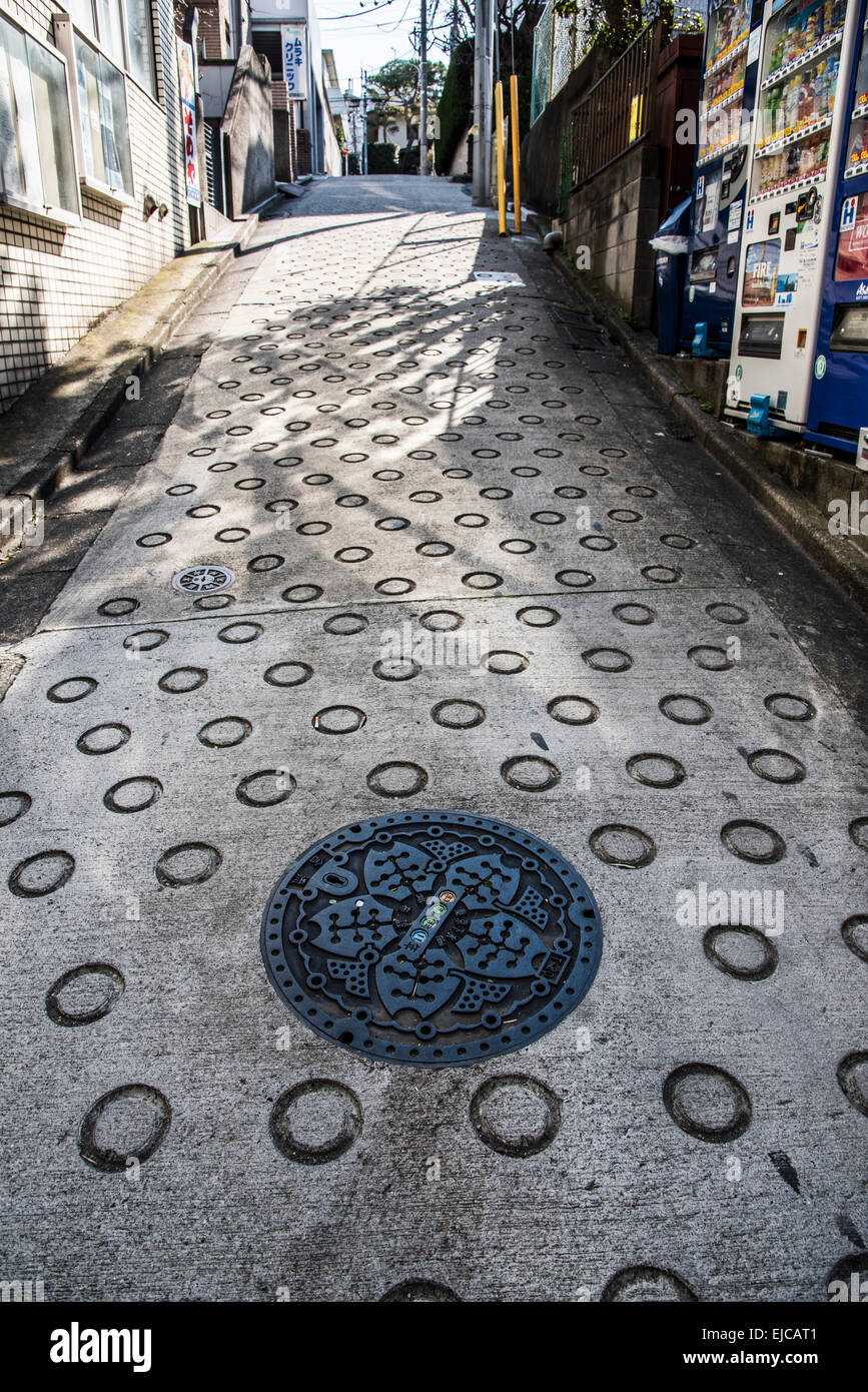 Japan street road day daytime circle slip manhole hi-res stock ...