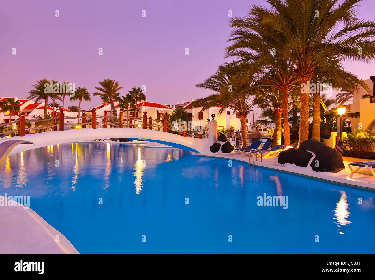 Swimming pool at sunset Stock Photo - Alamy