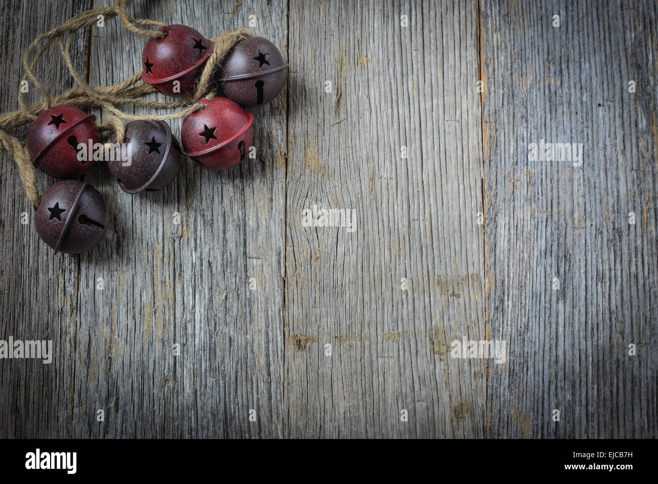 Rustic Christmas Bells and Wood Background Stock Photo - Alamy