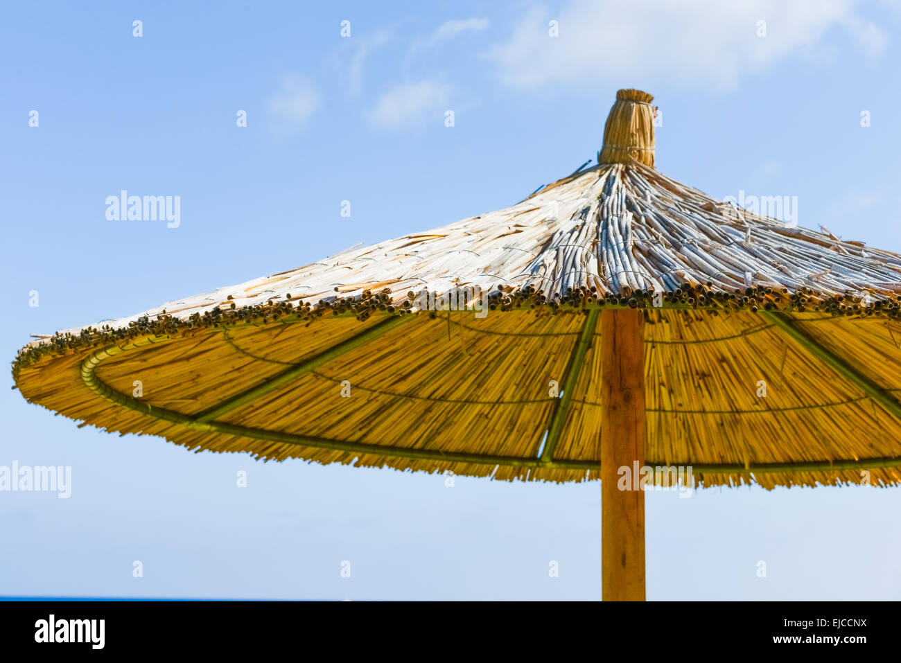 parasol of straw on the sea Stock Photo - Alamy