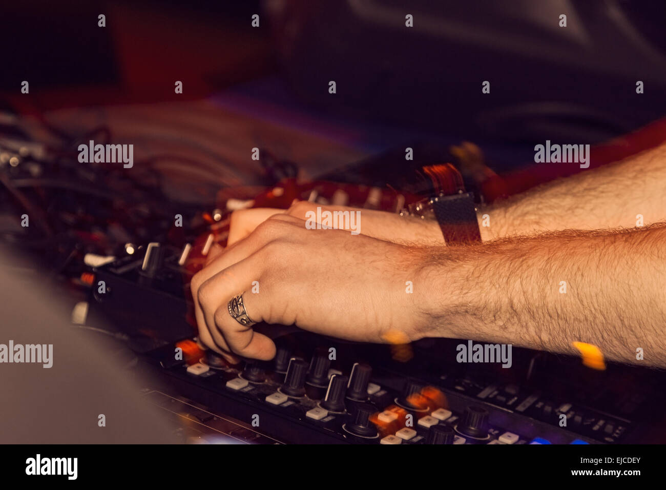 DJ hands on the remote. nightclub Stock Photo - Alamy