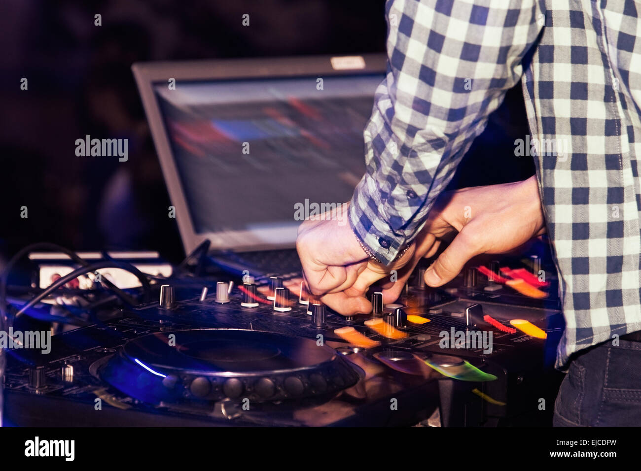 DJ hands on the remote. nightclub Stock Photo - Alamy