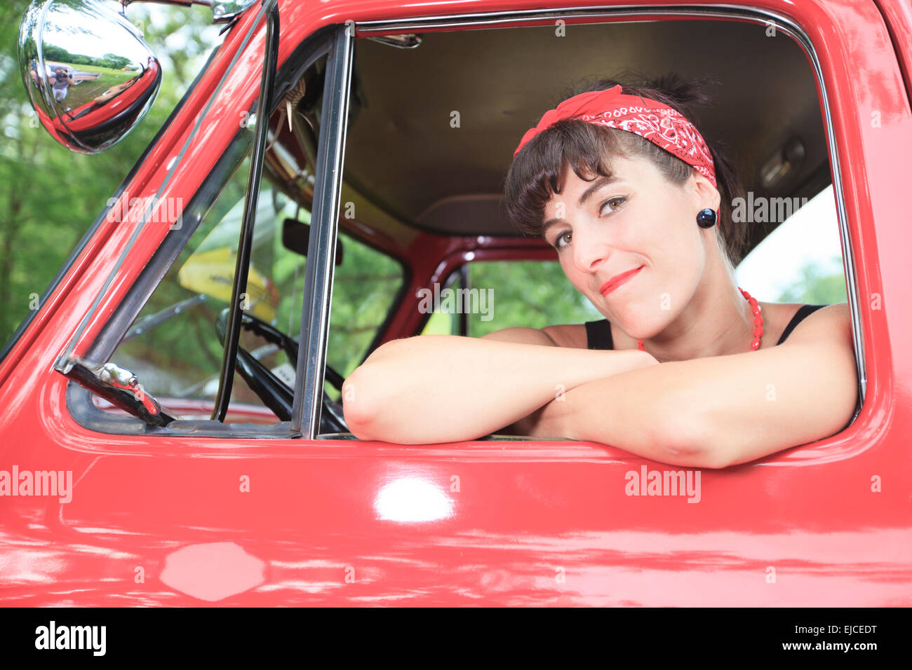 A retro girl with a beautiful red old car Stock Photo - Alamy
