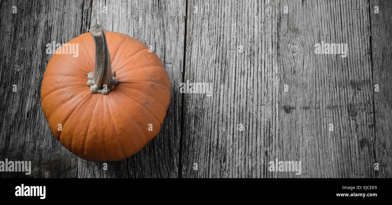 Pumpkin on Rustic Wood Background Stock Photo - Alamy