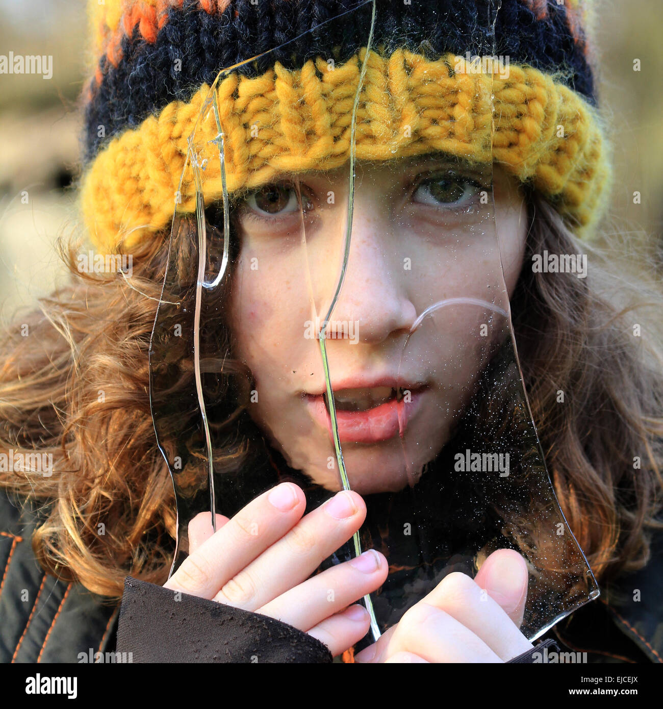 Boy is Looking through Ice Sheet Stock Photo - Alamy