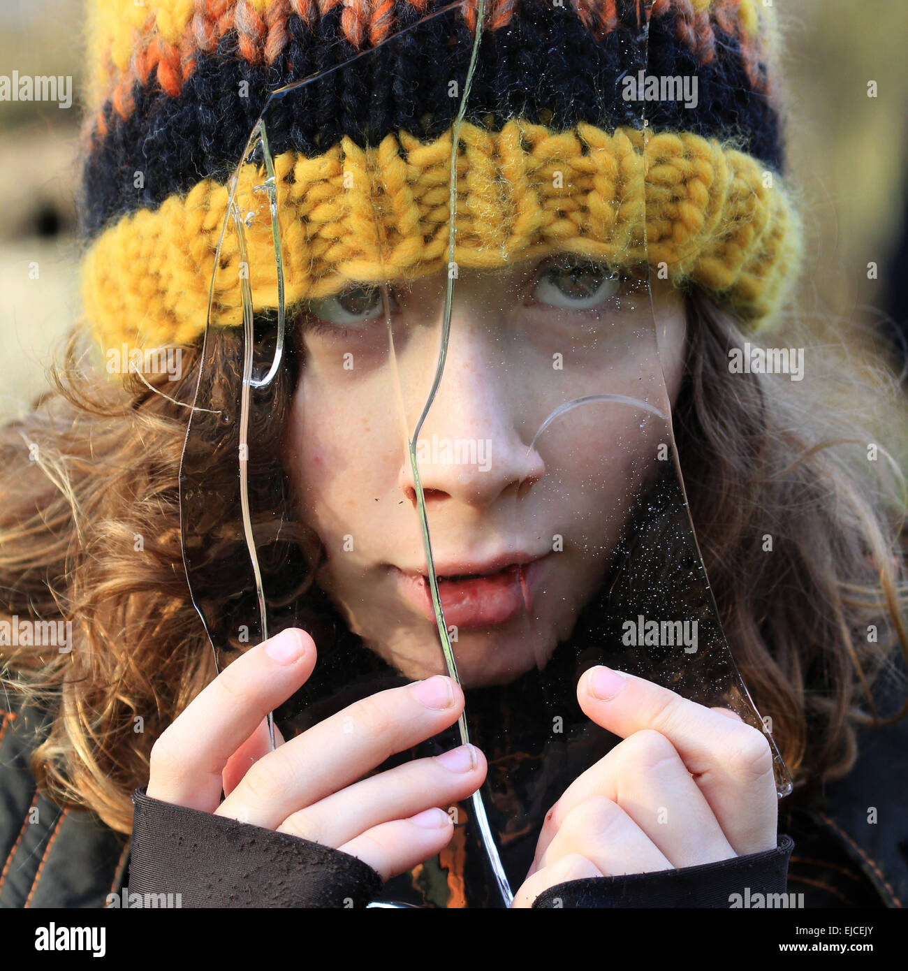 Boy is Looking through Ice Sheet Stock Photo - Alamy