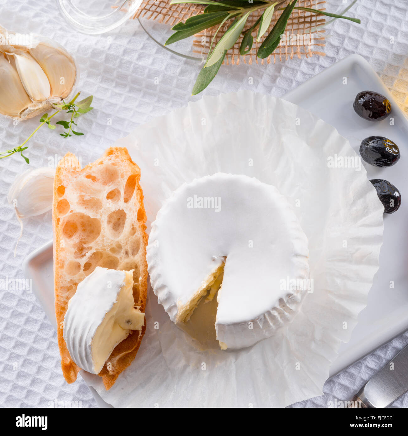 soft cheese with spicy olives Stock Photo - Alamy