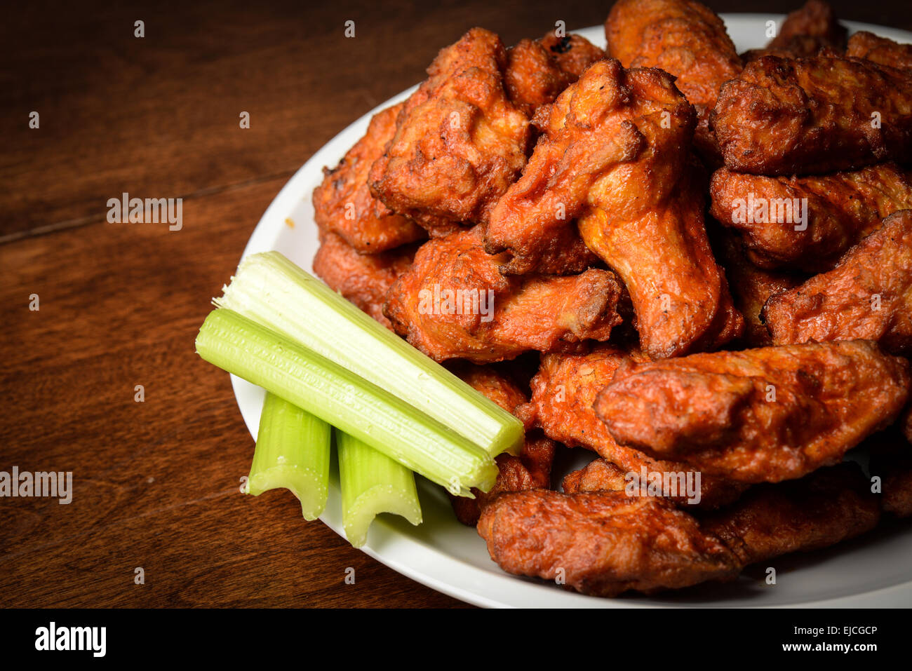 Chicken Buffalo Wings with Celery Sticks Stock Photo - Alamy