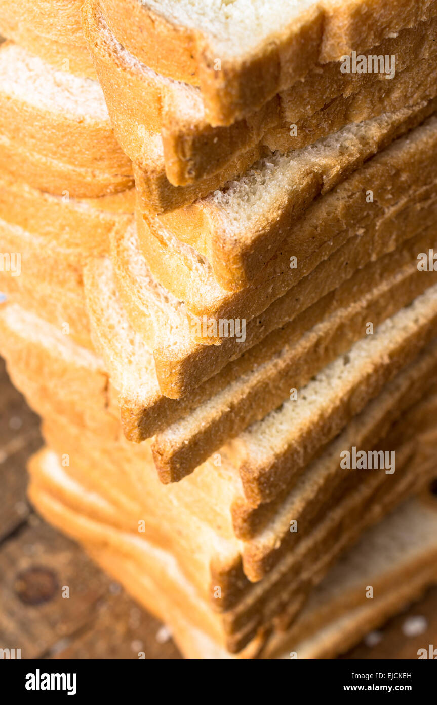 Toast bread slices to a lot of background Stock Photo - Alamy
