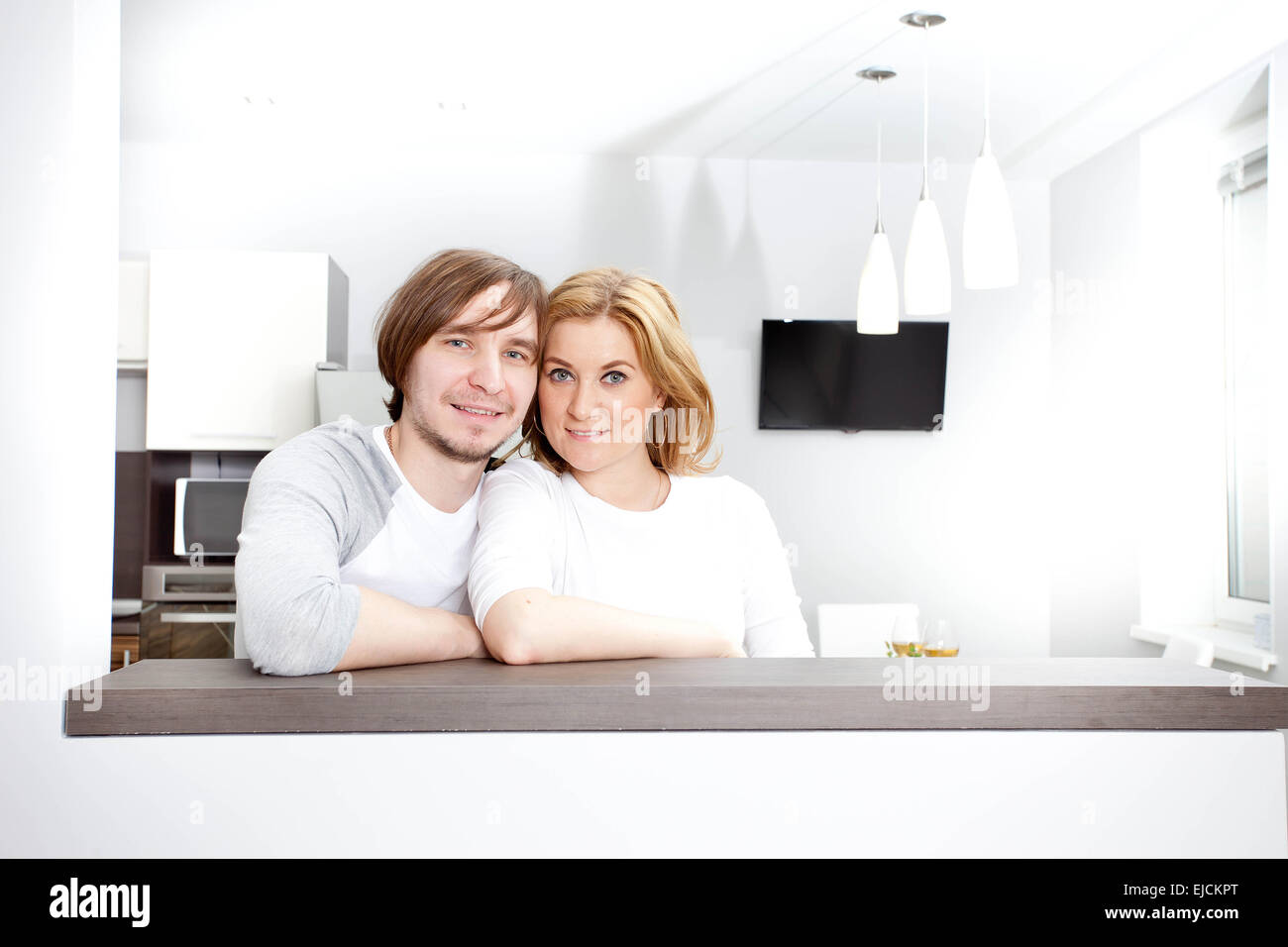 Smiling Couple In New Home Stock Photo - Alamy