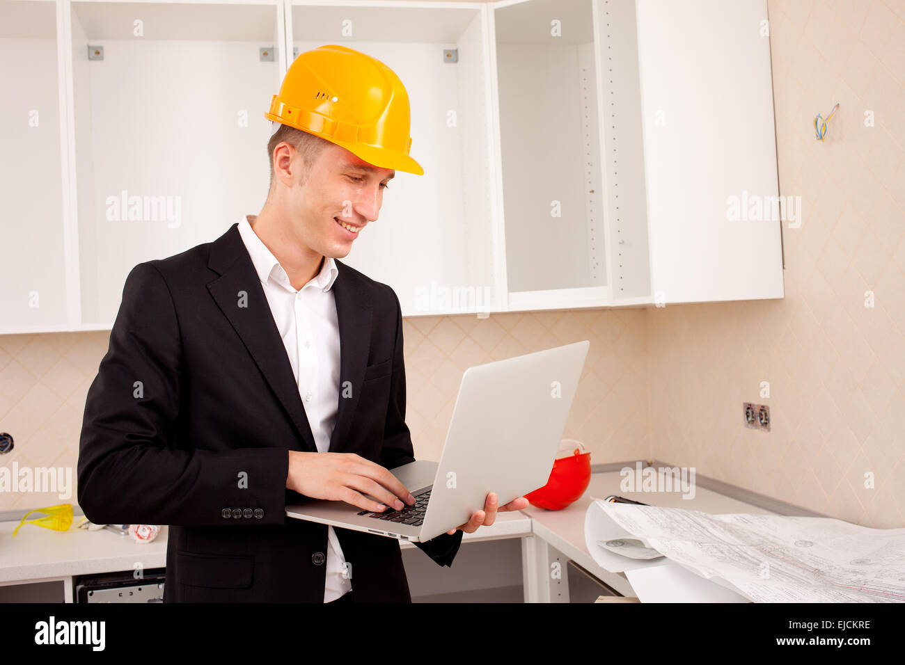 Engineer calculates estimates for repair Stock Photo - Alamy
