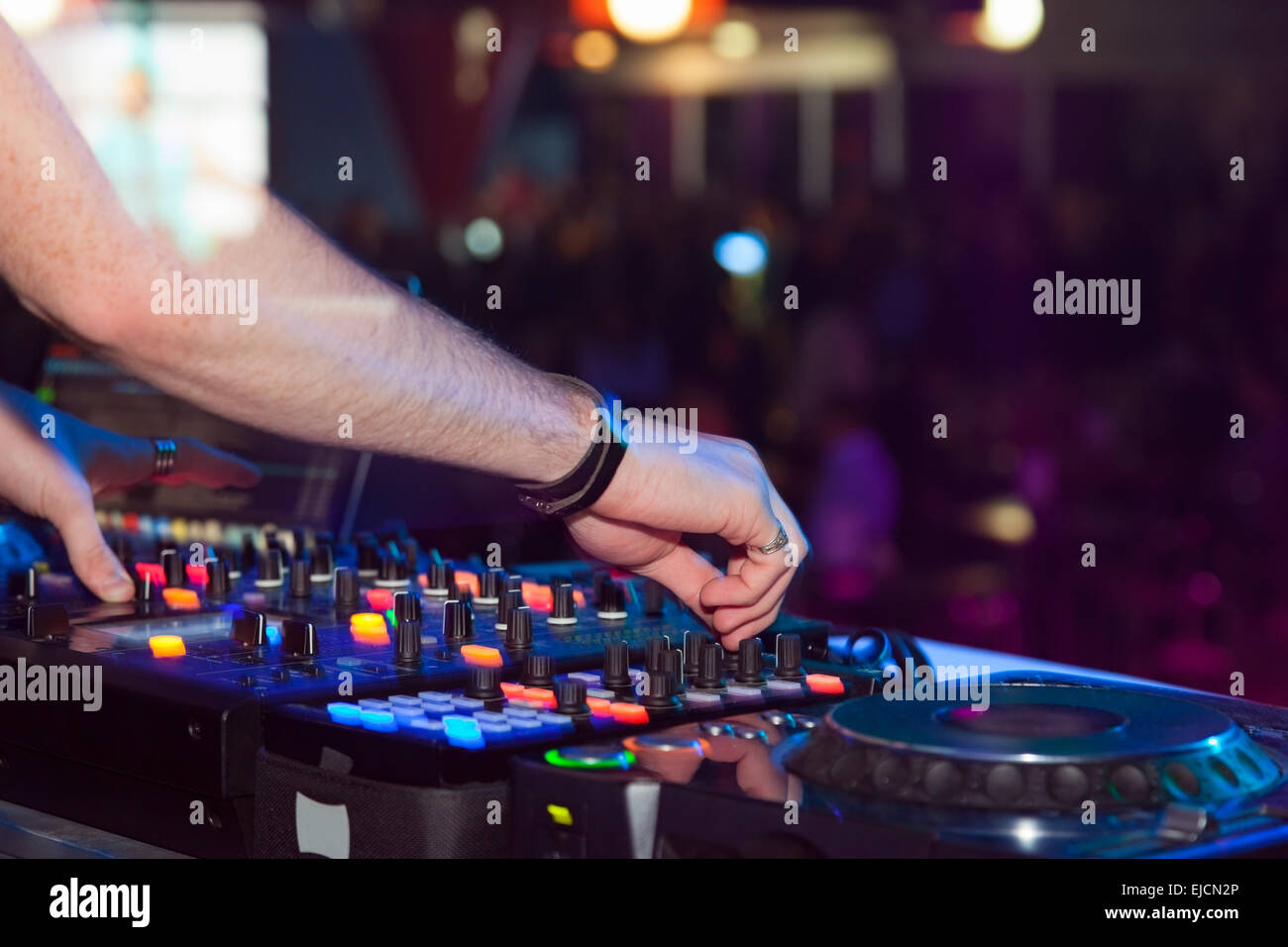 DJ hands on the remote. nightclub Stock Photo - Alamy