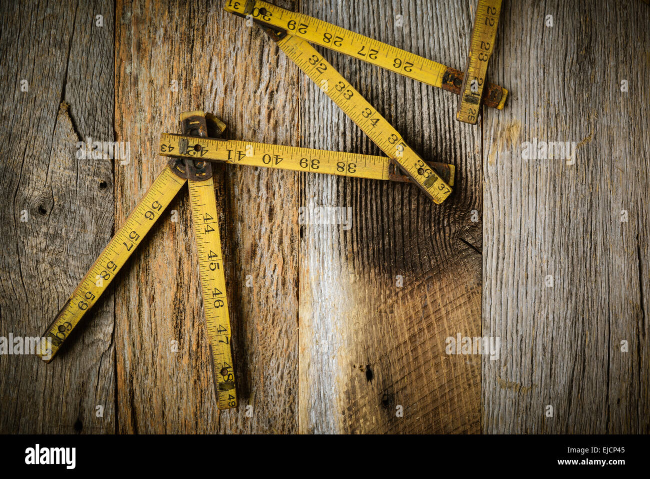 Old Tape Measure on Rustic Wood Background Stock Photo - Alamy