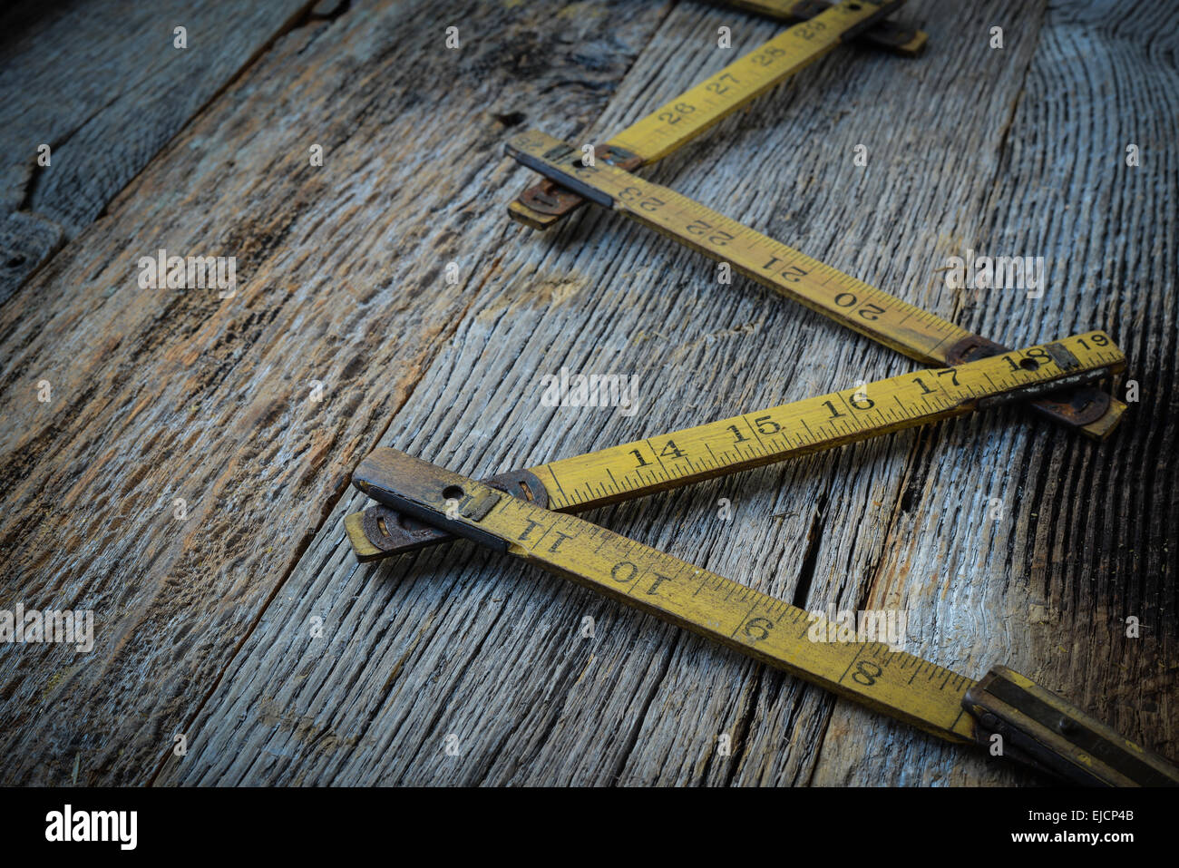 Old Tape Measure on Rustic Wood Background Stock Photo - Alamy