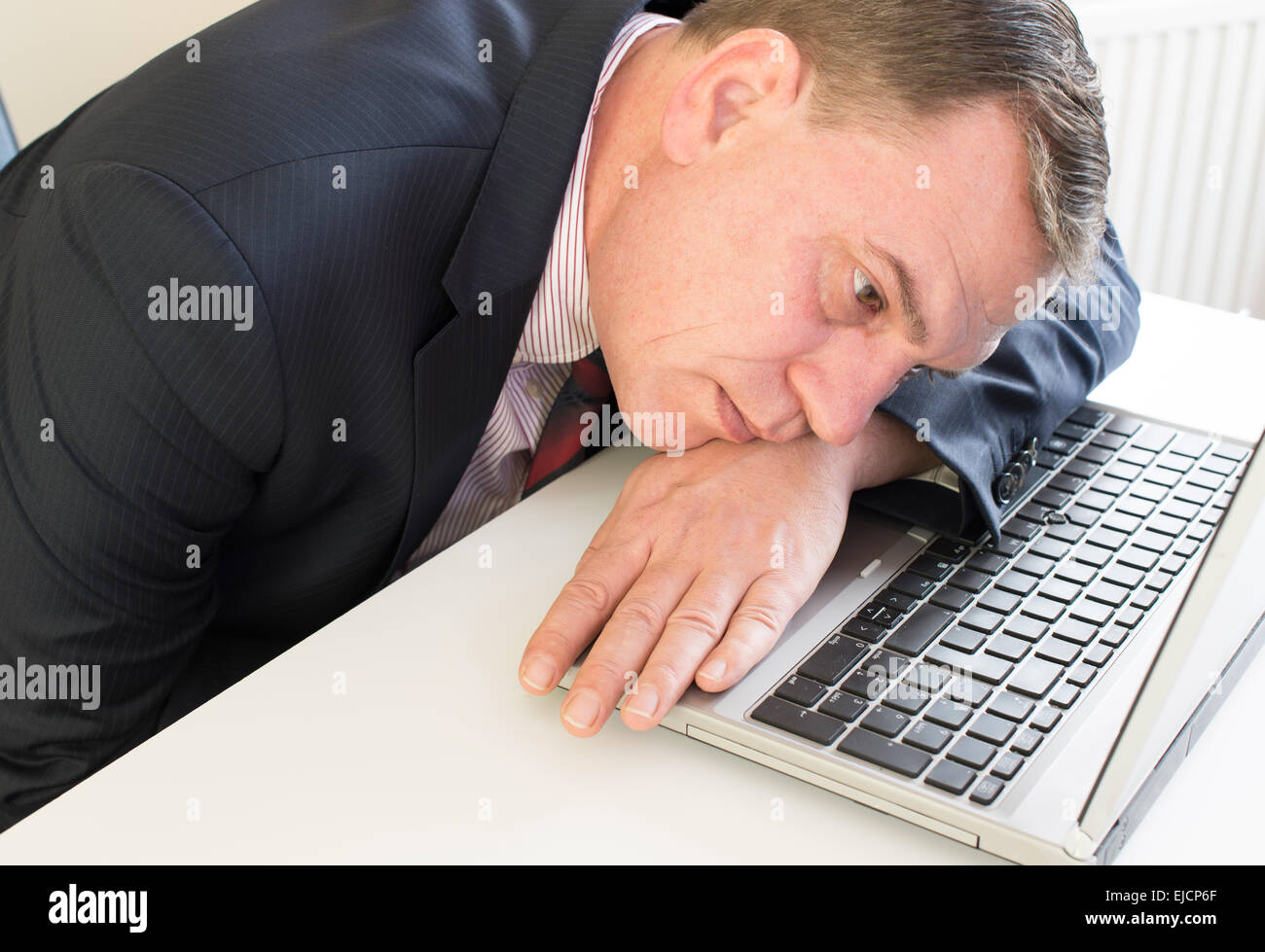 Business man has Burn Out Stock Photo - Alamy