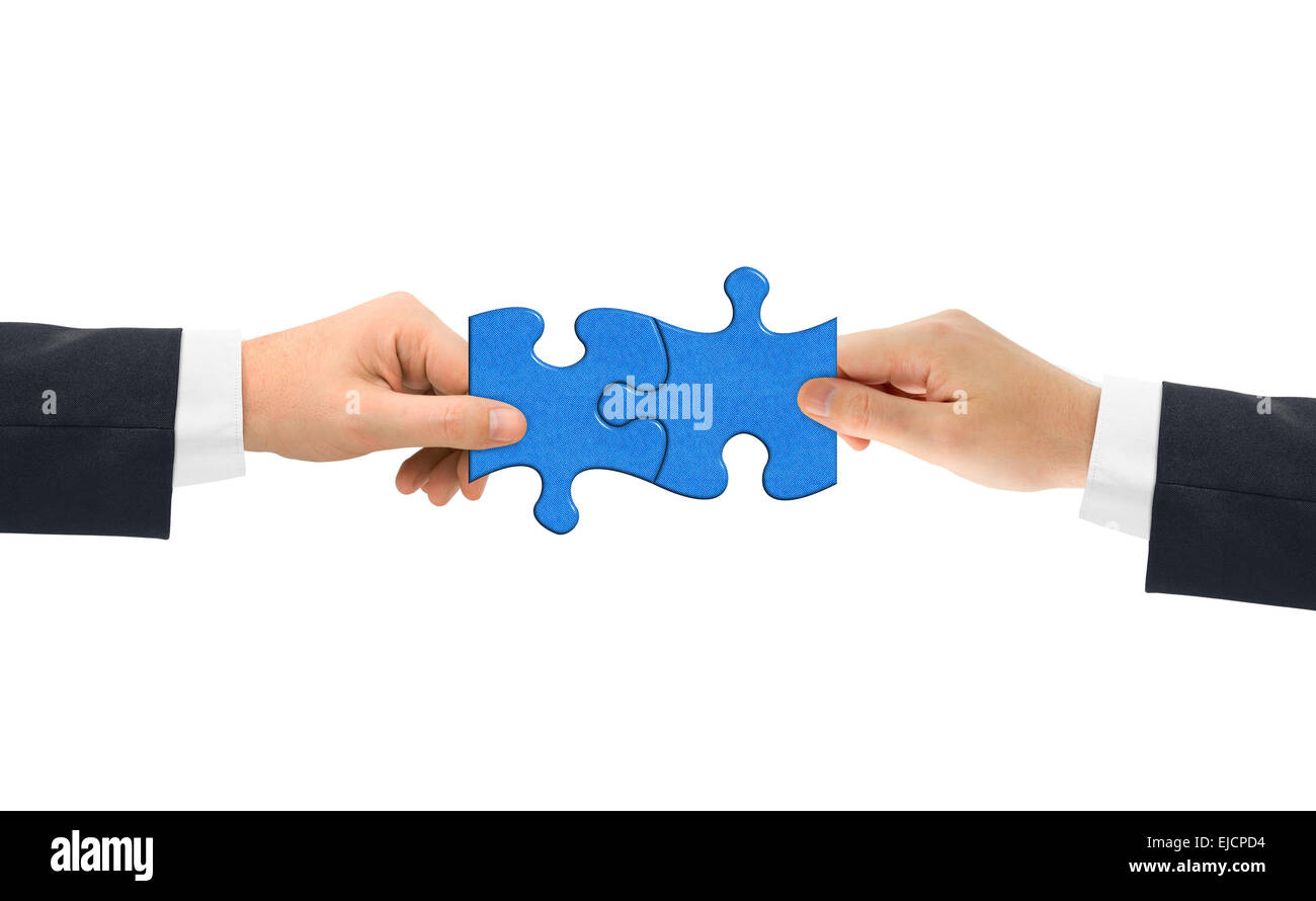 Hands and puzzle Stock Photo - Alamy