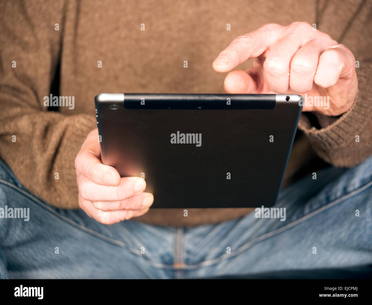 Hands holding tablet Stock Photo - Alamy