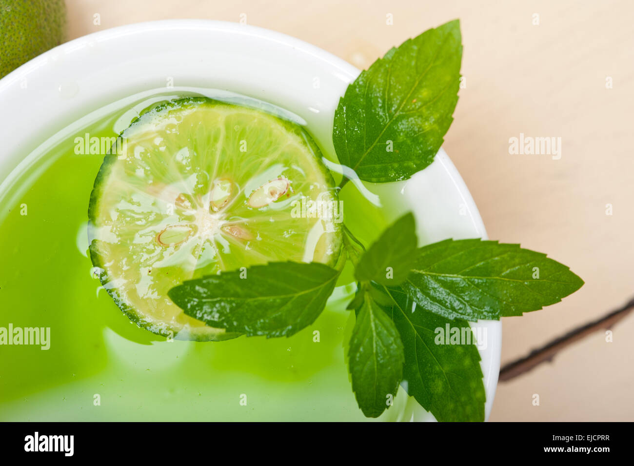 mint infusion tea tisane with lime Stock Photo - Alamy