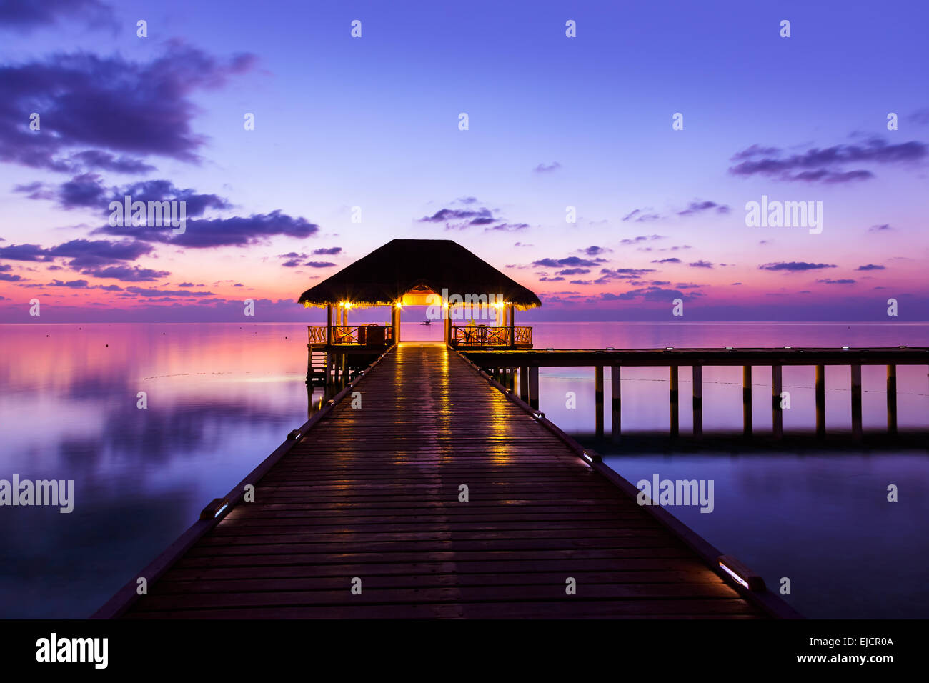 Water cafe at sunset - Maldives Stock Photo - Alamy