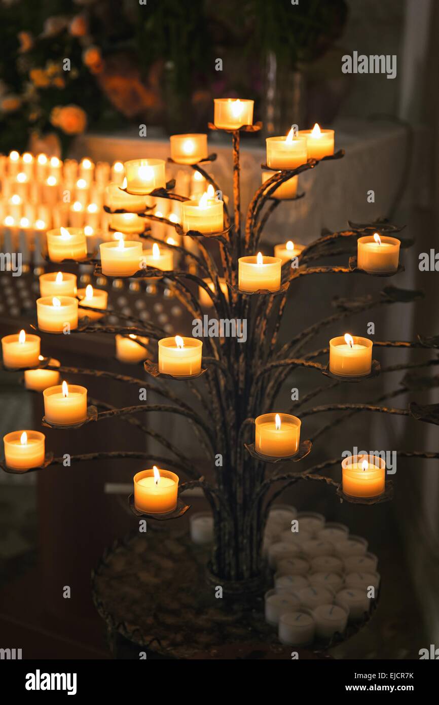 Golden light candles in church hi-res stock photography and images - Alamy