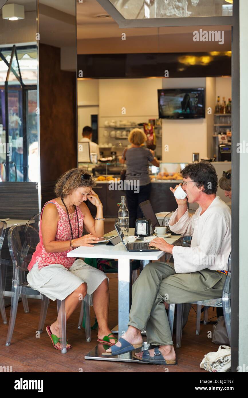 Working at coffee bar hi-res stock photography and images - Alamy