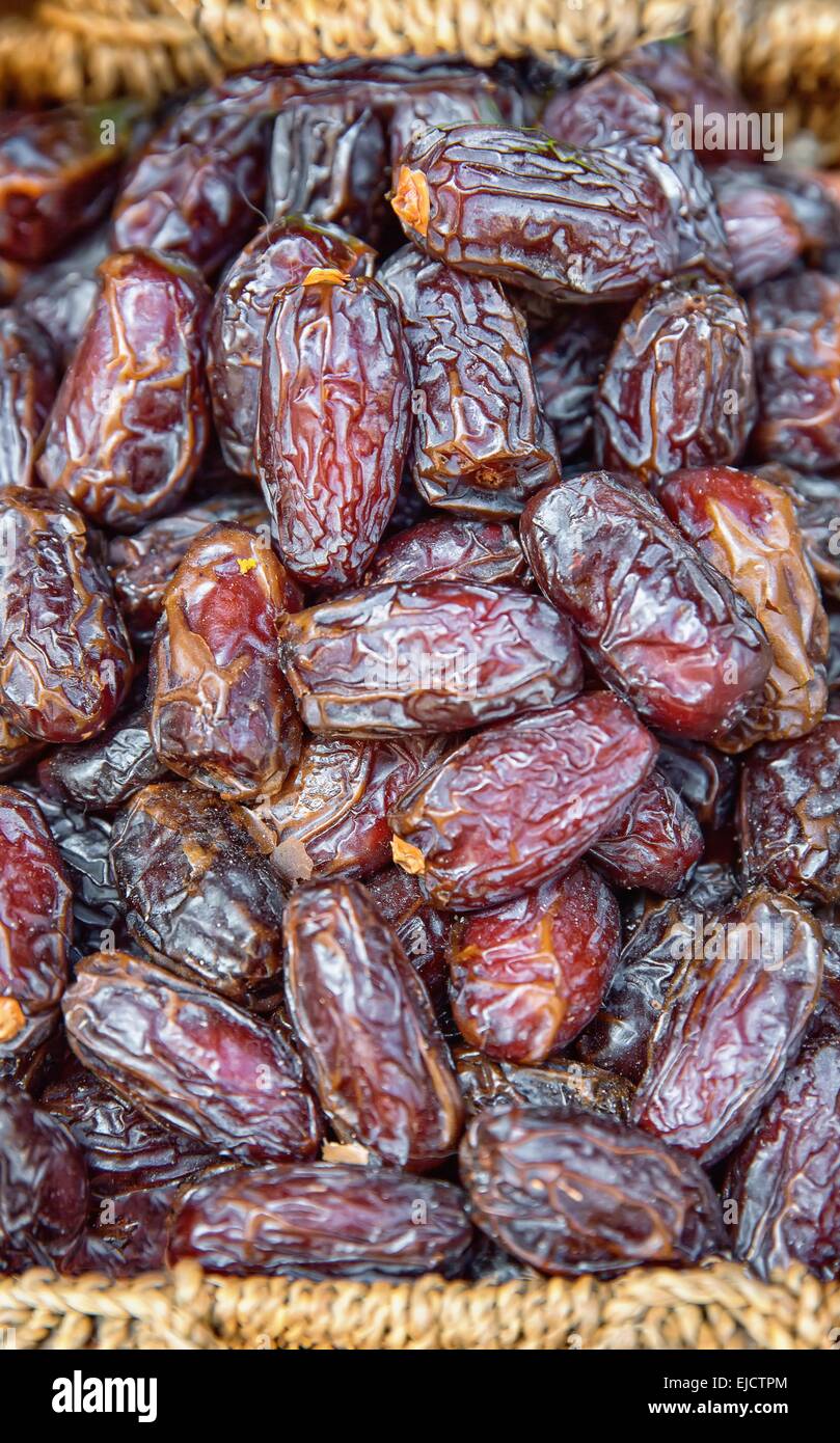 Dates in wicker basket at the market Stock Photo - Alamy