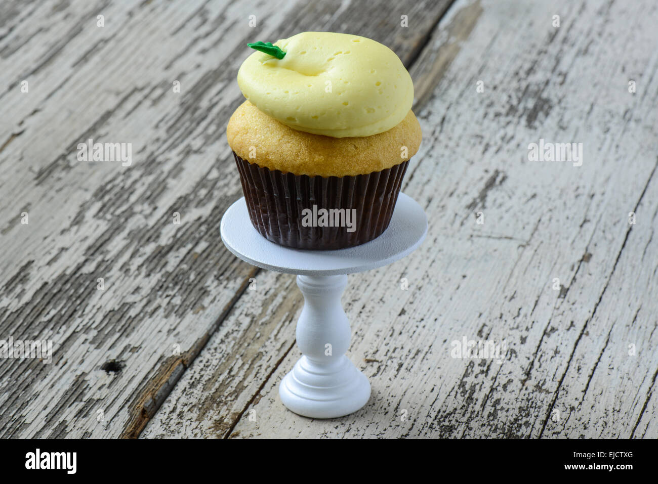 Lemon Cupcake on a Cupcake Stand Stock Photo - Alamy