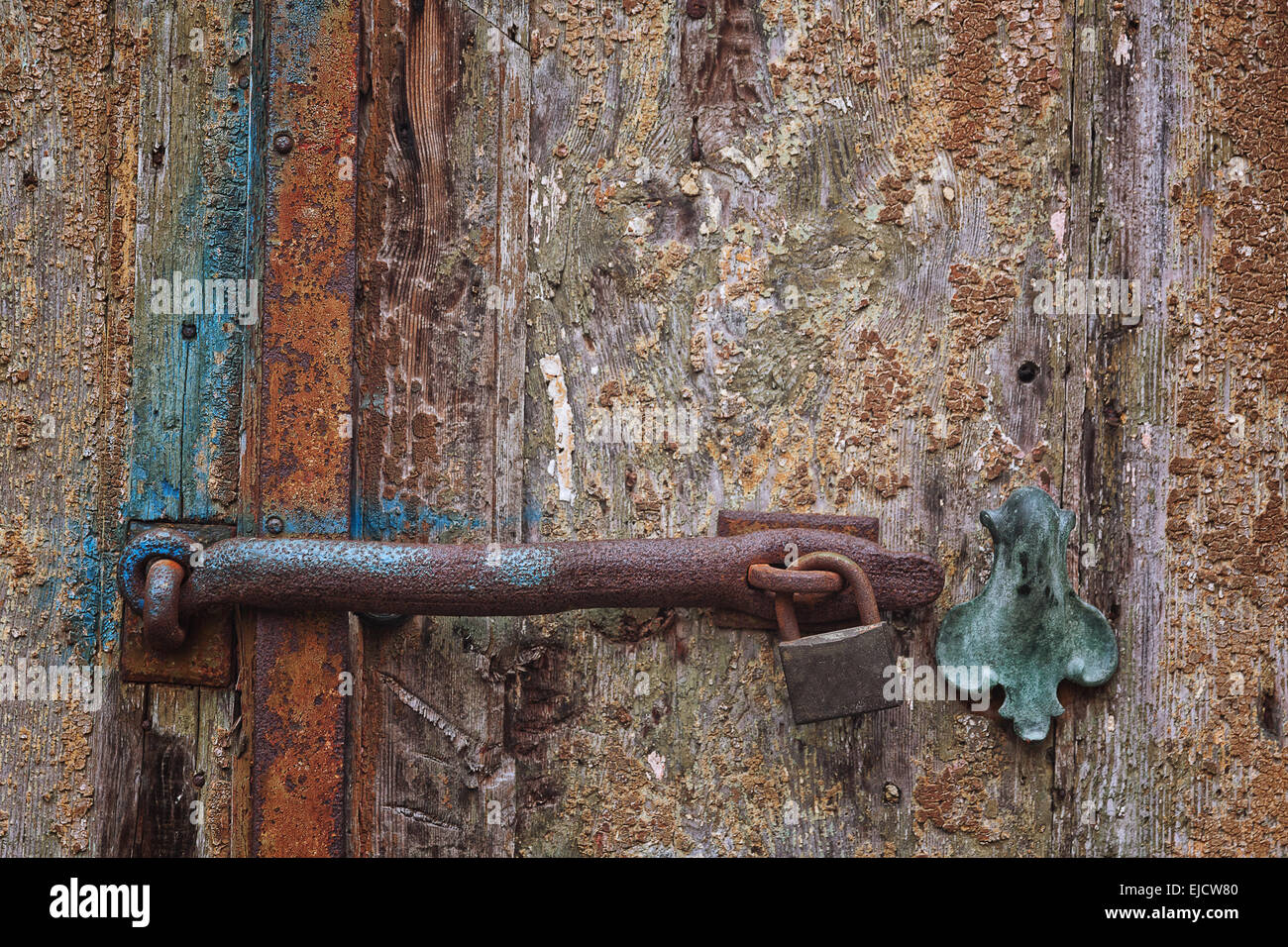 Rusty lock on wooden door Stock Photo - Alamy