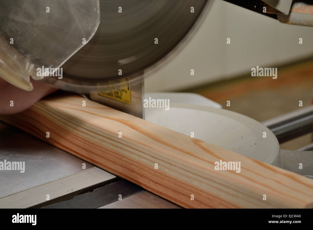 Carpenter saws with miter saw Stock Photo - Alamy