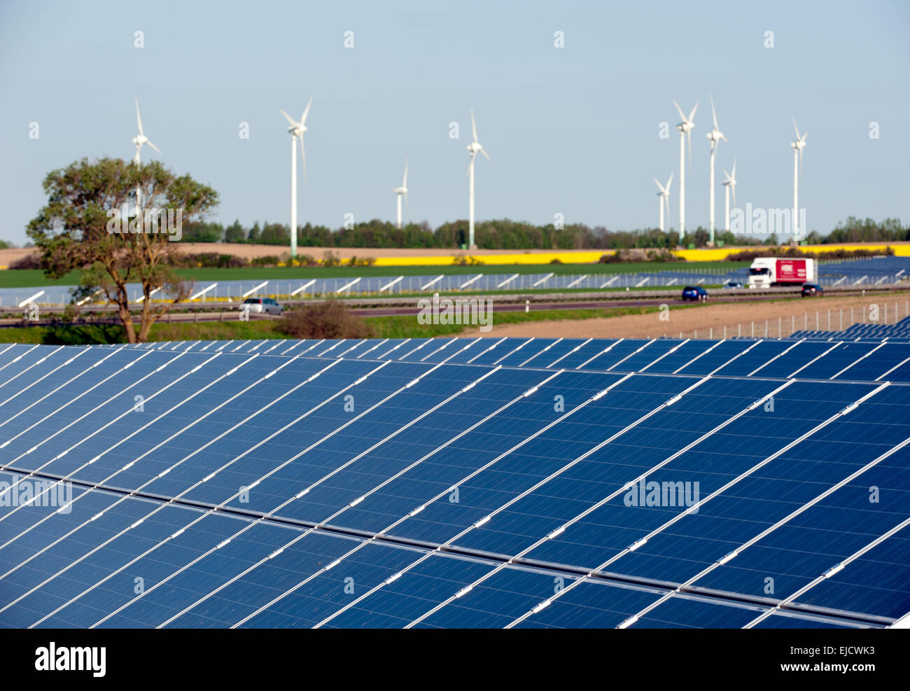 Rape field, solar modules, wind turbines Stock Photo - Alamy