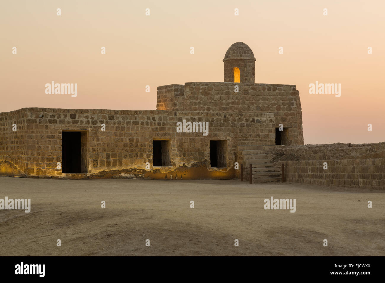Old Bahrain Fort at Seef at sunset Stock Photo - Alamy