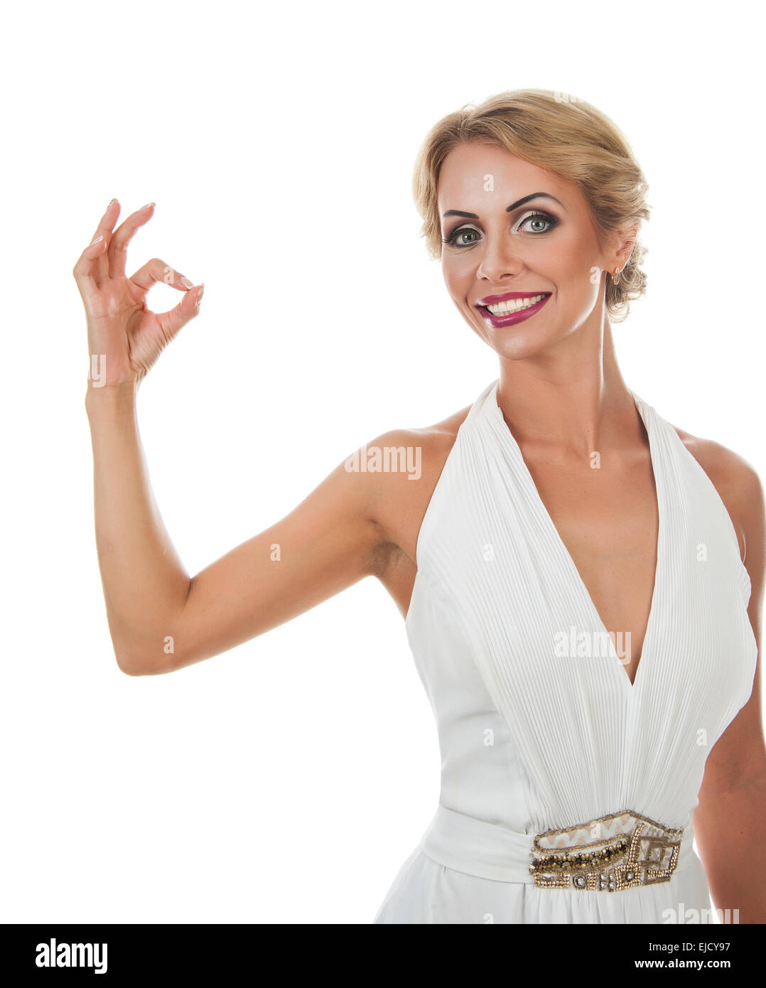 Smiling woman showing ok sign Stock Photo - Alamy