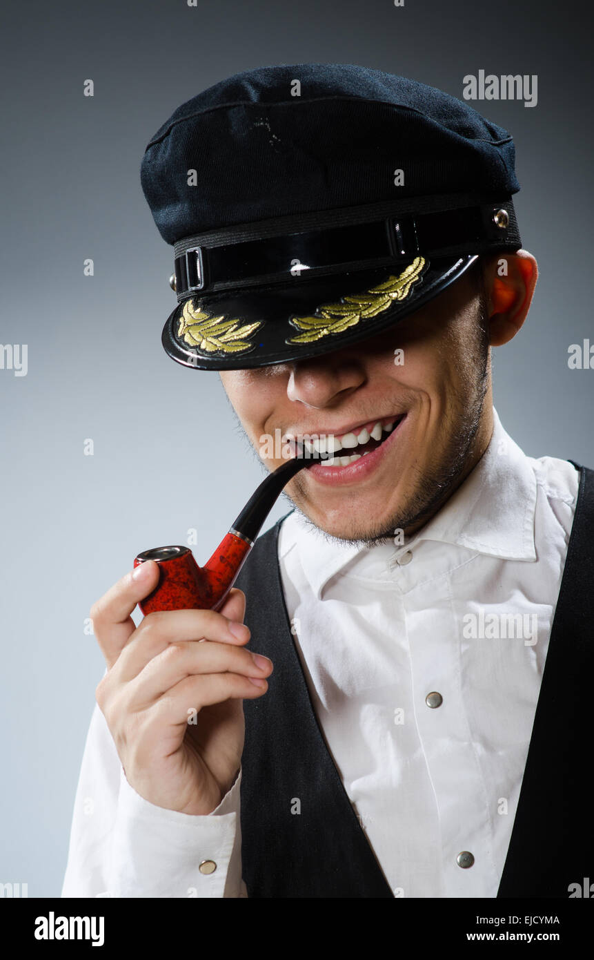 Captain smoking pipe with tobacco Stock Photo - Alamy