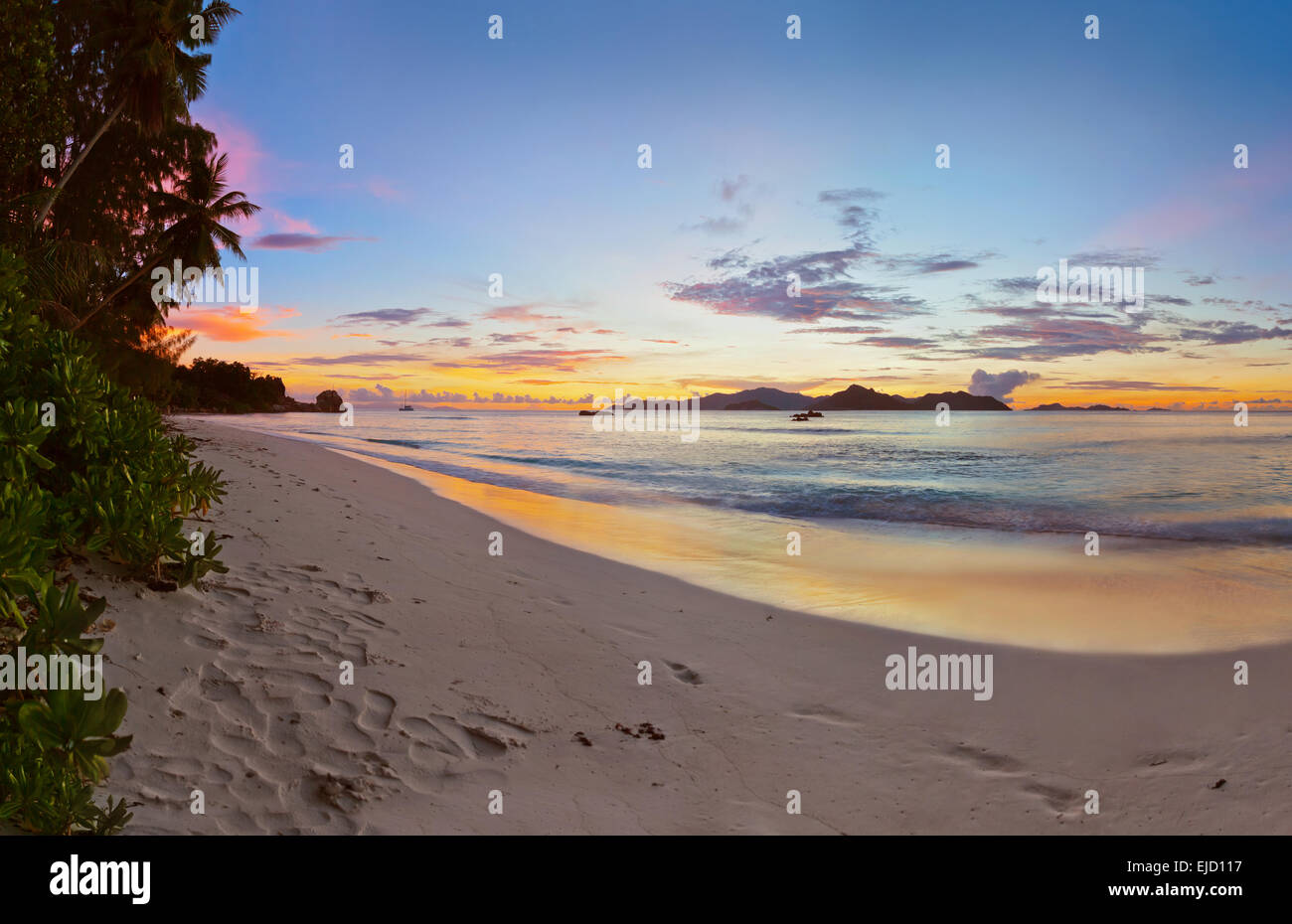 Sunset on tropical beach - Seychelles Stock Photo - Alamy