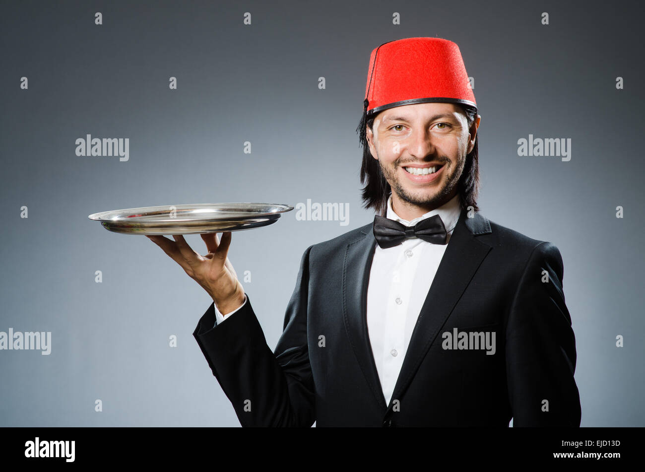 Waiter wearing traditional turkish hat Stock Photo - Alamy