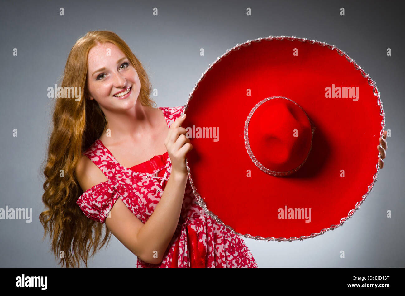 Mexican woman wearing red sombrero Stock Photo - Alamy