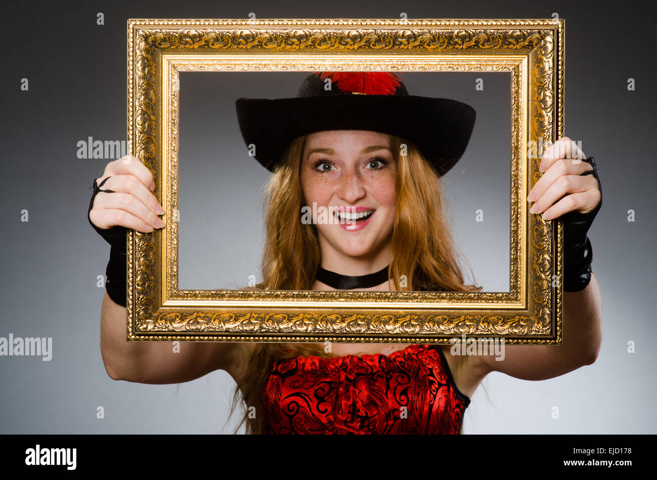 Woman pirate with picture frame Stock Photo - Alamy